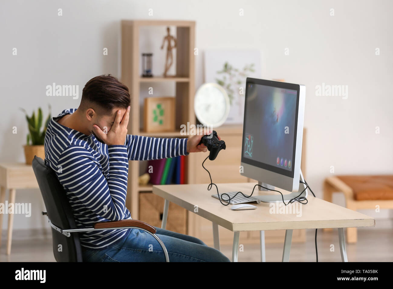 Sad gamer upset after hi-res stock photography and images - Alamy