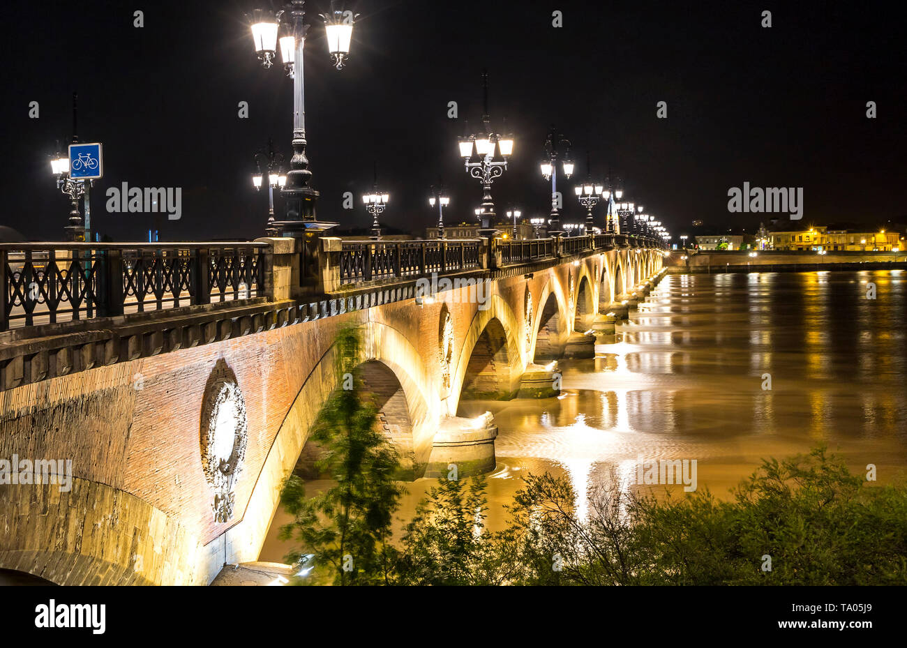 Night view of The Pont de Pierre, bridge over the Garonne river in ...