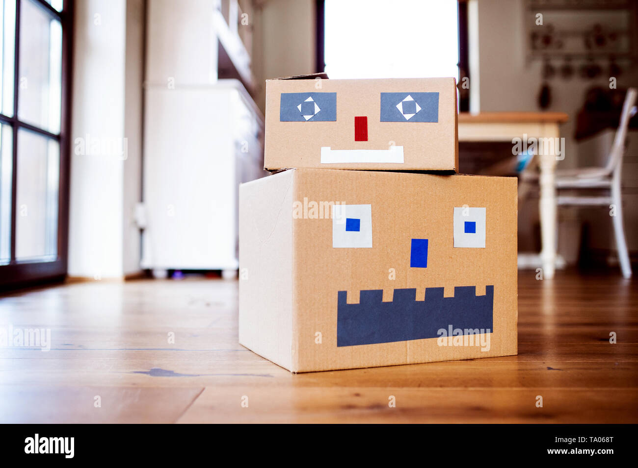 Two cardboard monsters on the floor indoors, diy toy art and craft ...