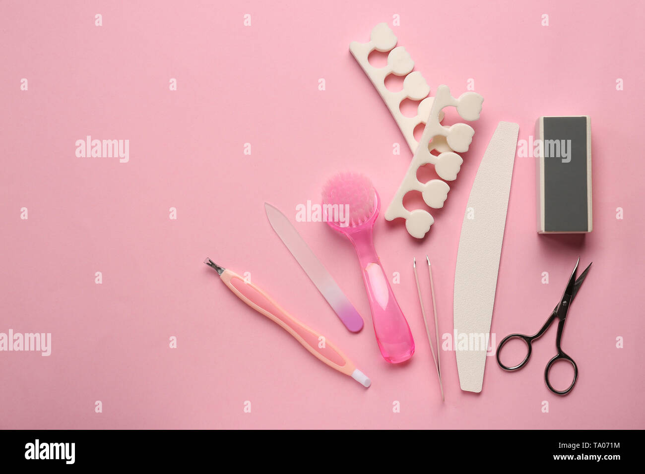 Set of pedicure tools on color background Stock Photo - Alamy