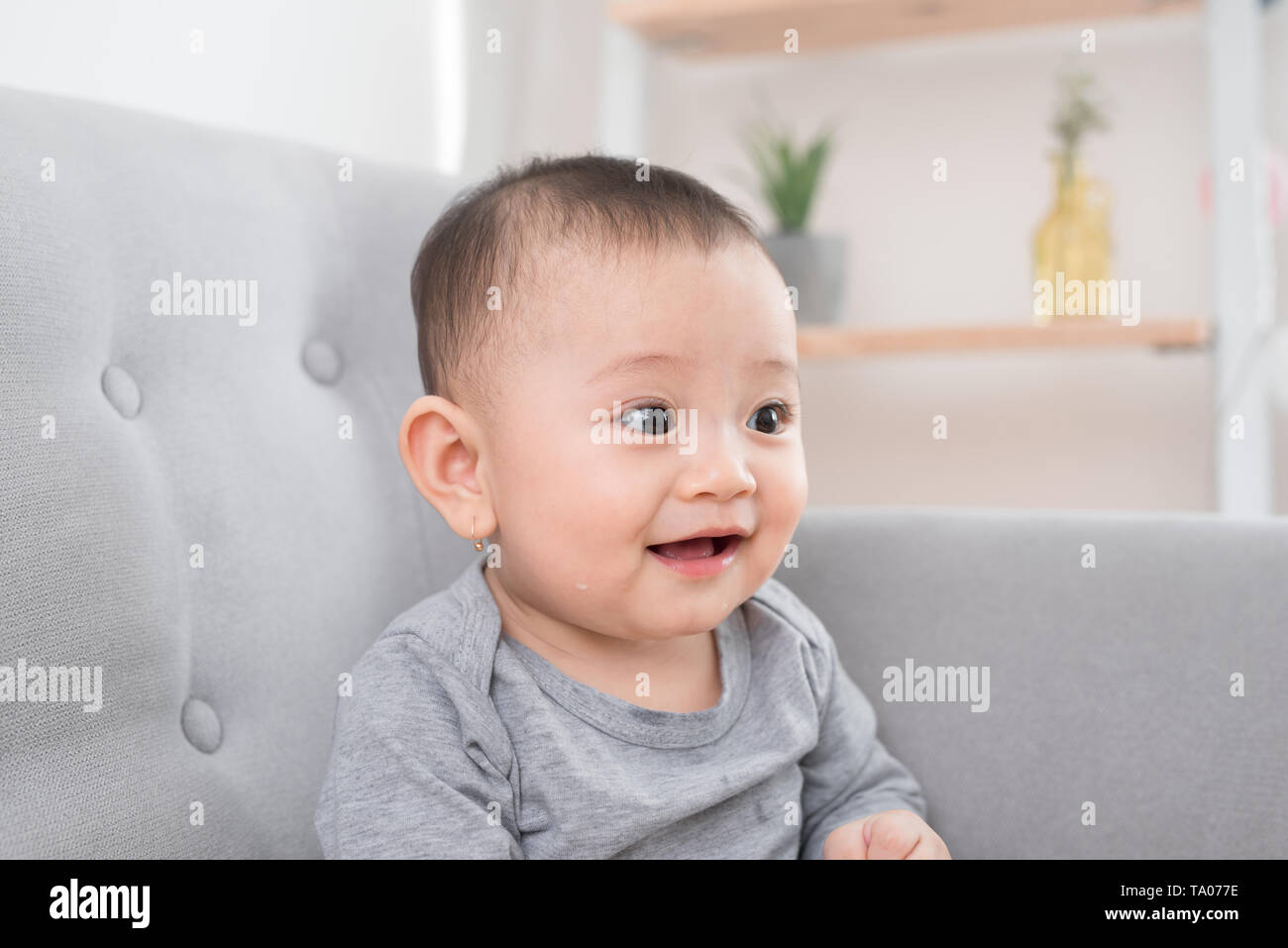 childhood, babyhood and people concept - happy little baby girl sitting ...