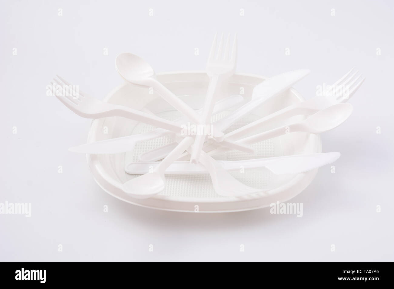 Disposable plastic crockery isolated on white background Stock Photo ...