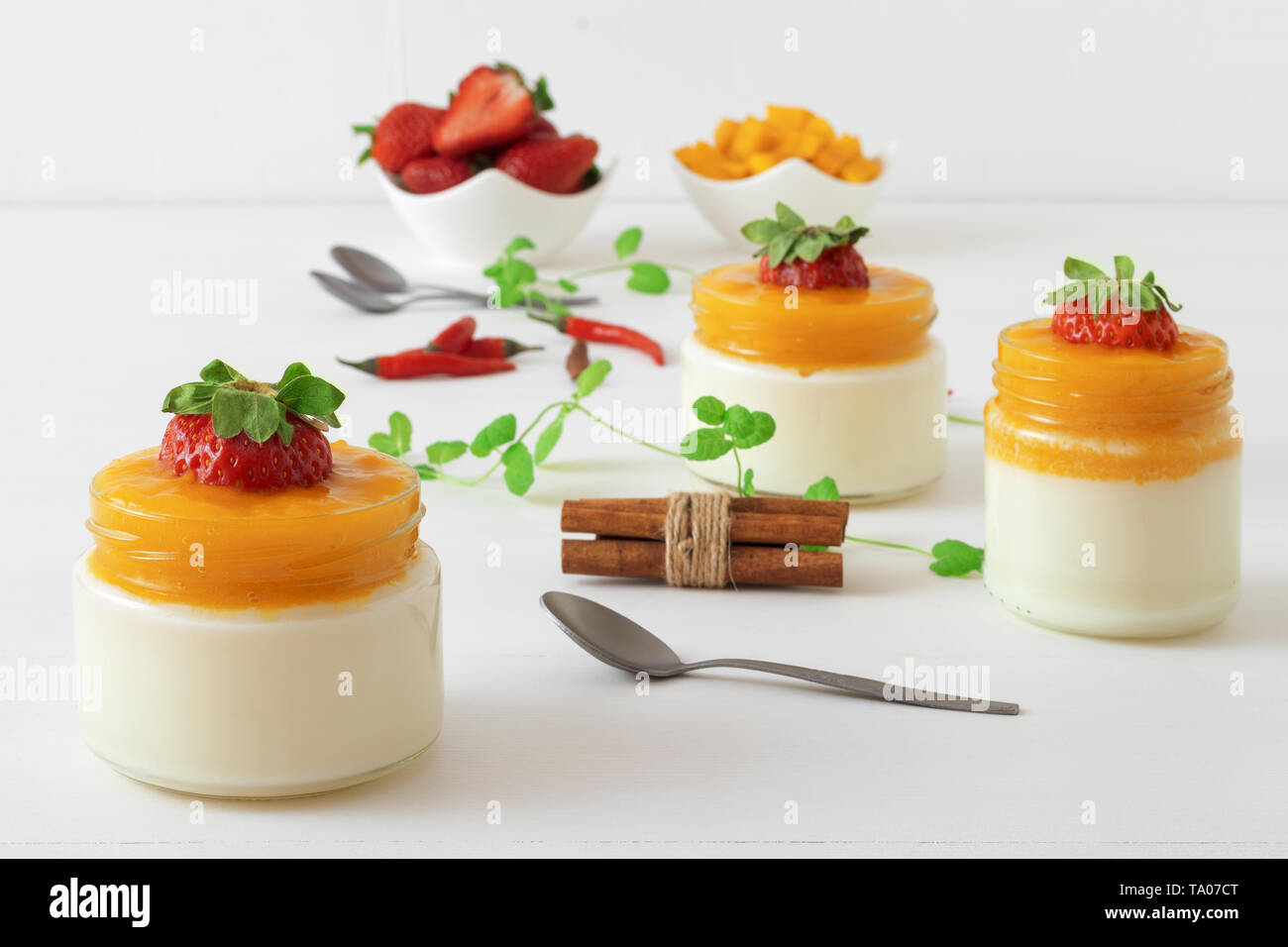 Traditional Italian sweet dessert Panna cotta with mango jelly with ...