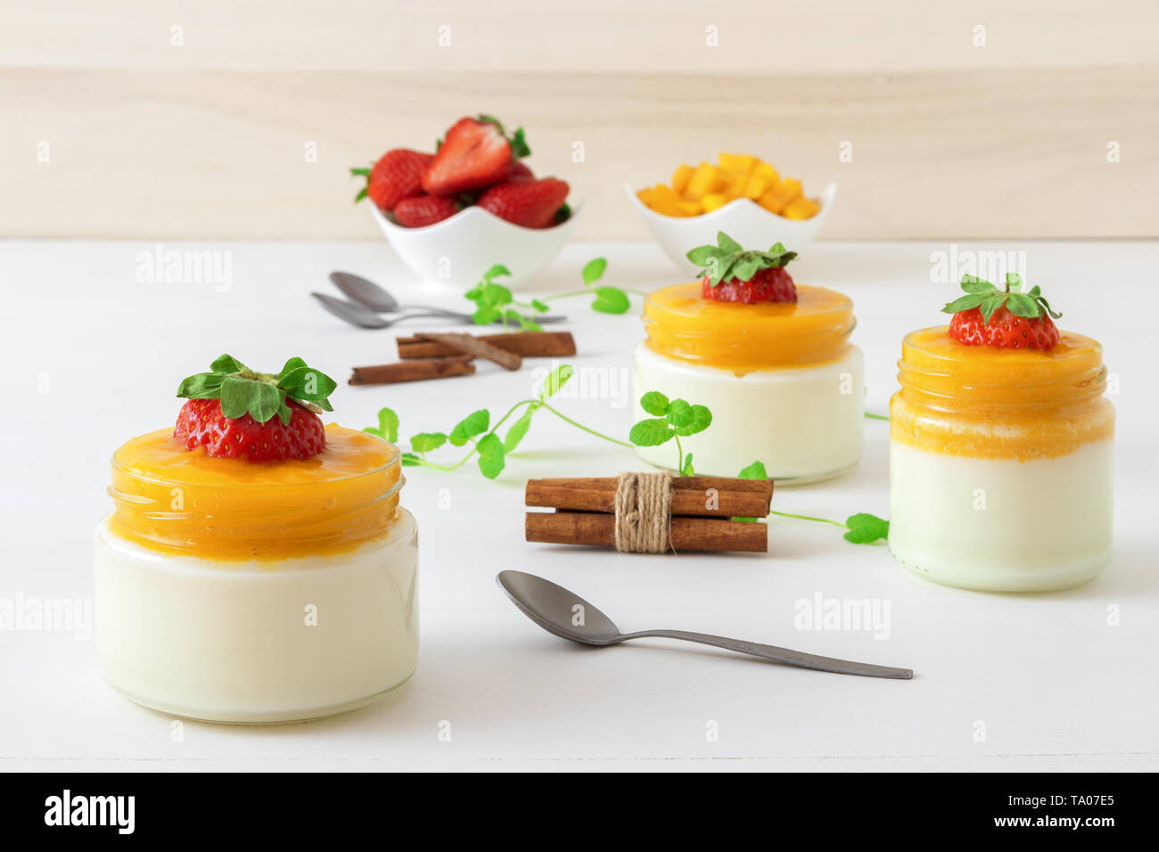 Traditional Italian sweet dessert Panna cotta with mango jelly with ...