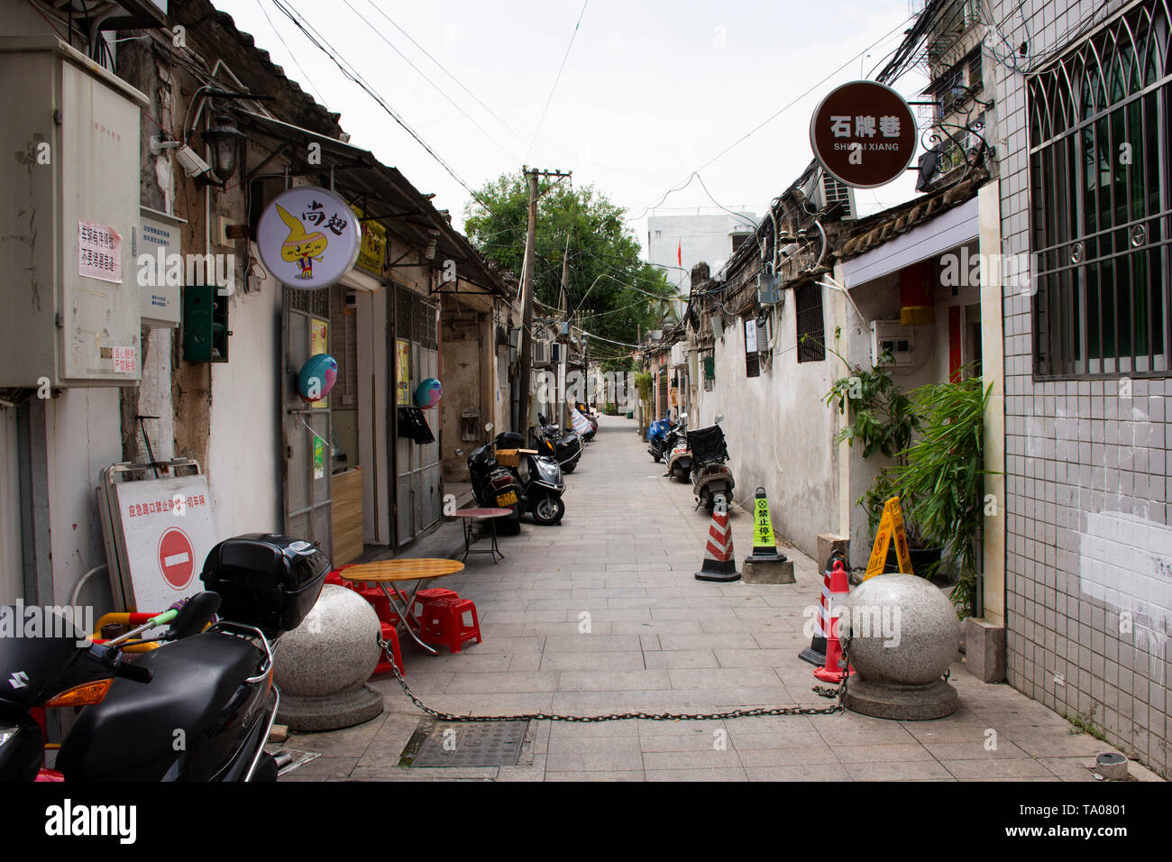 Chinese people walking in small alley at Paifang Street go to house in ...