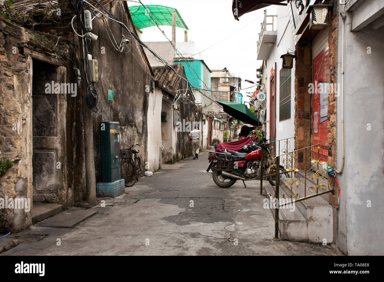 Chinese people walking in small alley at Paifang Street go to house in ...