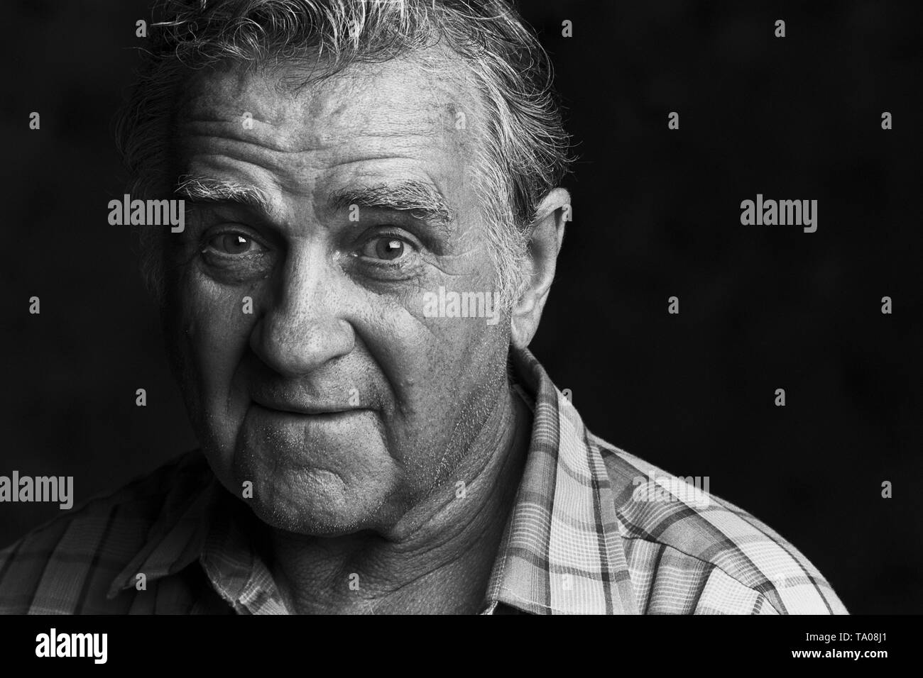 Closeup serious portrait old senior Black and White Stock Photos ...