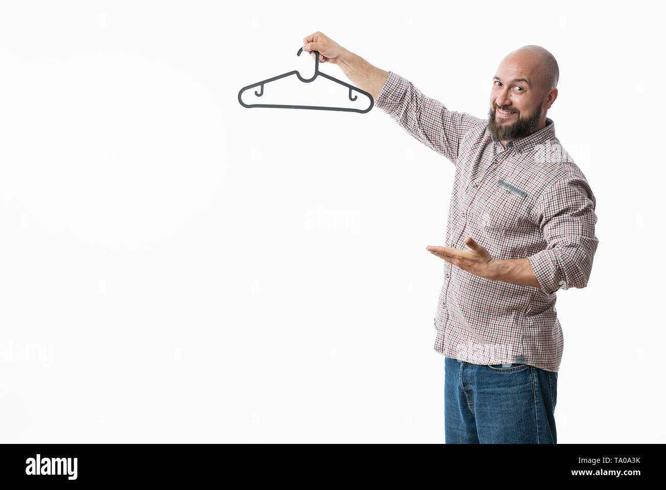 Man holds in his hand a hanger isolated on white Stock Photo - Alamy