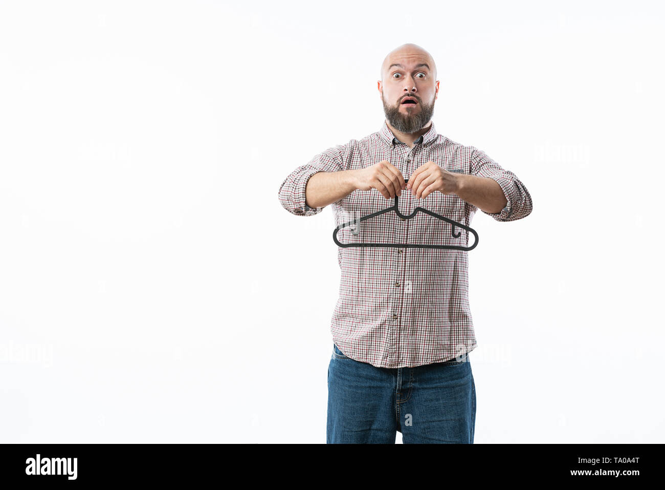 Man holds in his hand a hanger isolated on white Stock Photo - Alamy