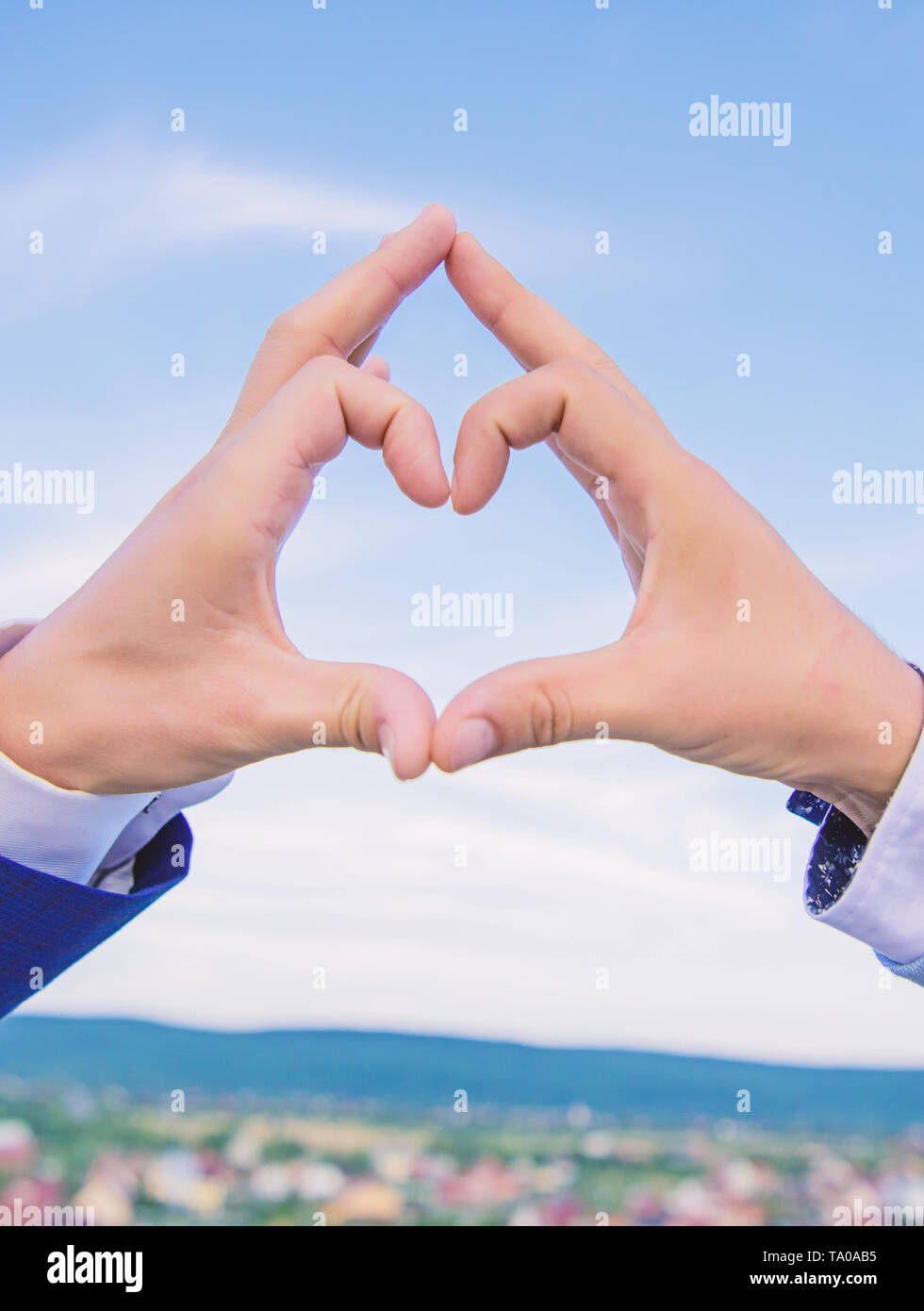 Male hands in heart shape gesture symbol of love and romance. Hand ...