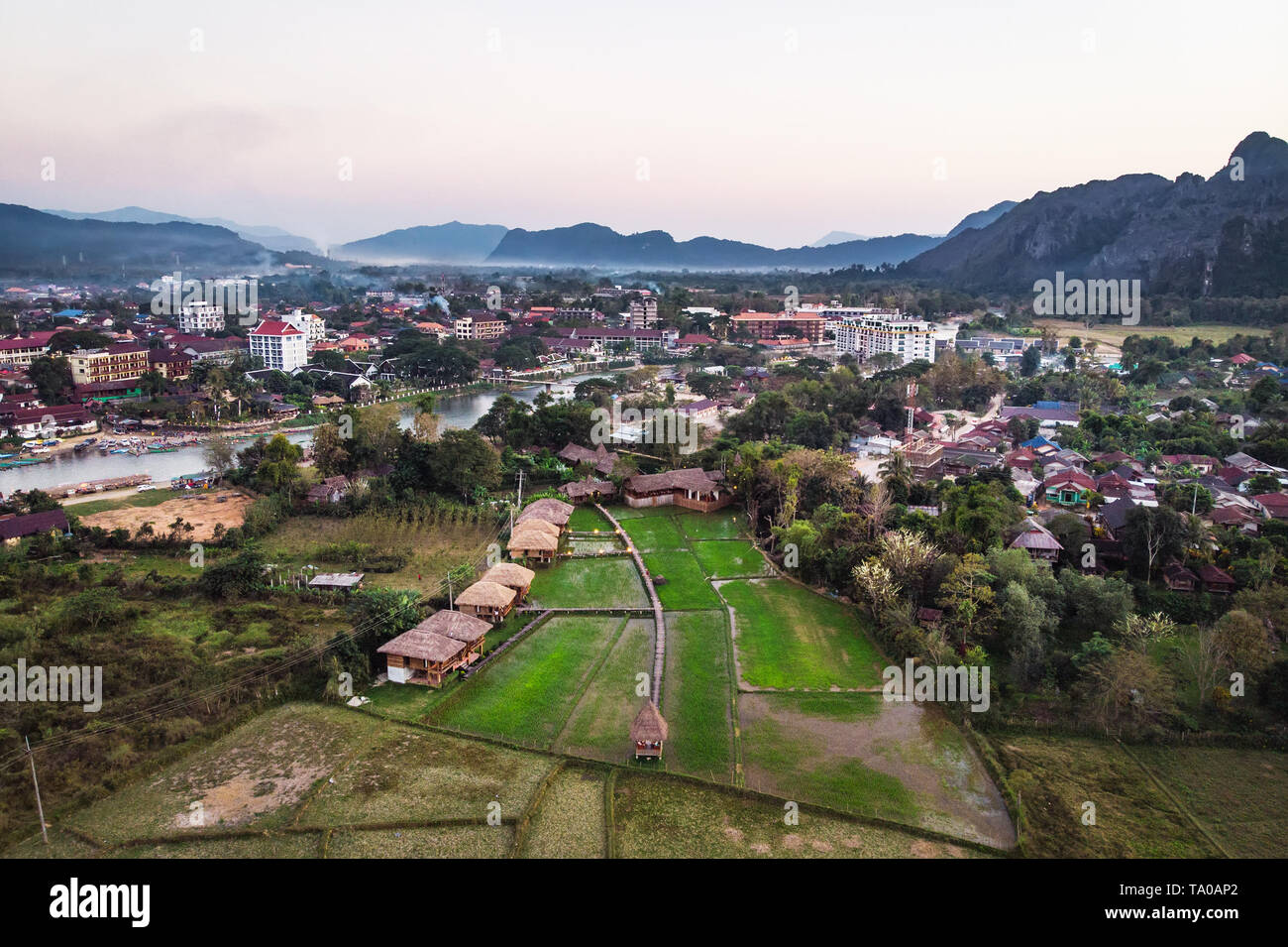 Aerial view of farm fields and rock formations in Vang Vieng, Laos ...