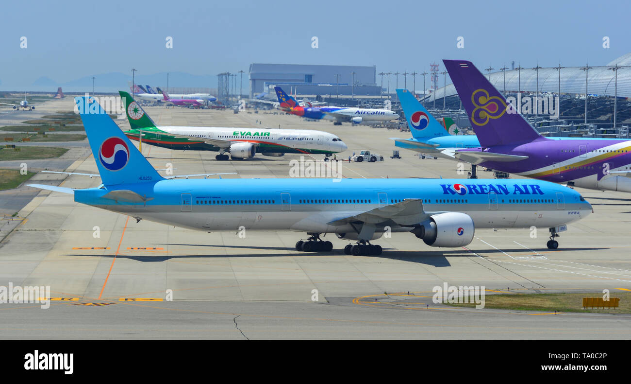 Osaka, Japan - Apr 18, 2019. Passenger airplanes taxiing on runway of ...