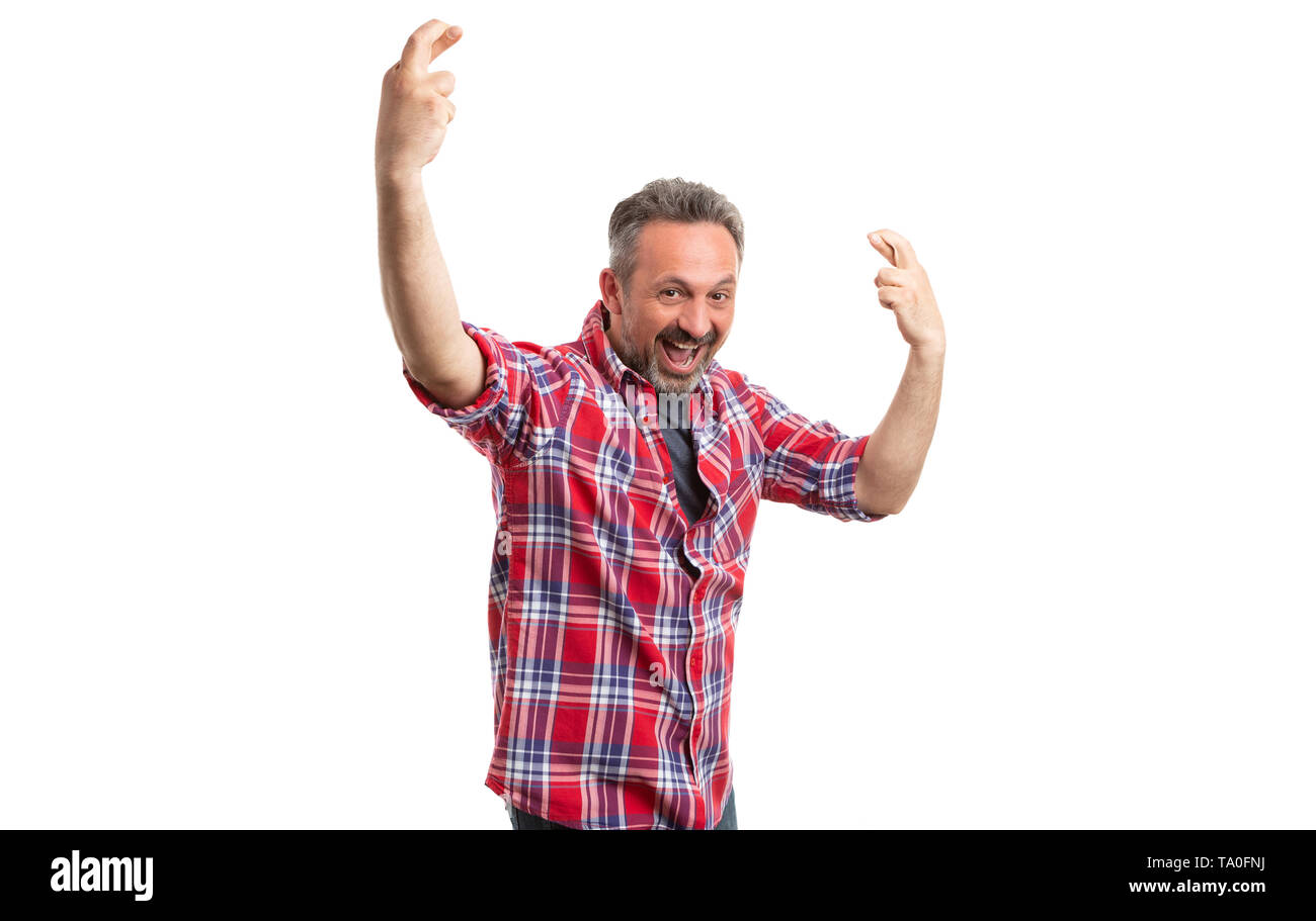 Hopeful man smiling as showing good luck gesture with fingers crossed ...