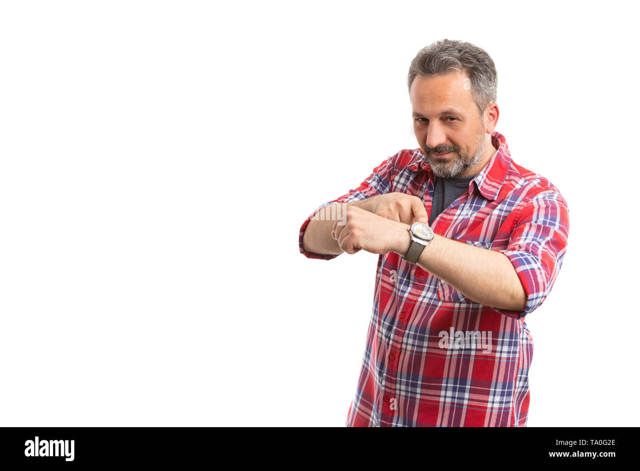 Serious man pointing index finger at watch on wrist as you are late ...