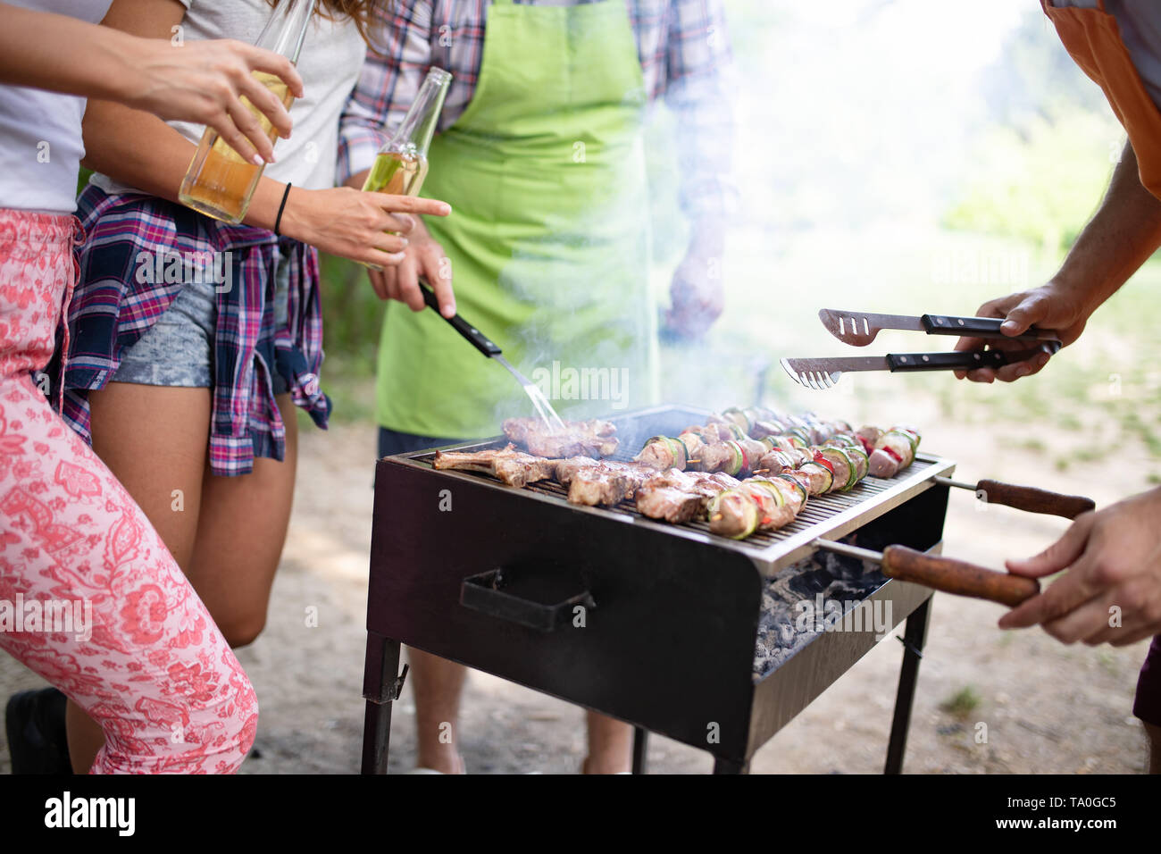 Assorted meat from chicken, pork and various vegetables on barbecue ...