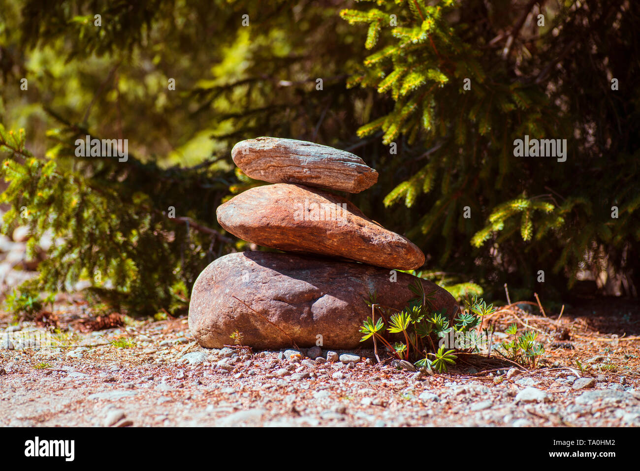 Stones pyramid on pebble beach symbolizing stability, zen, harmony ...