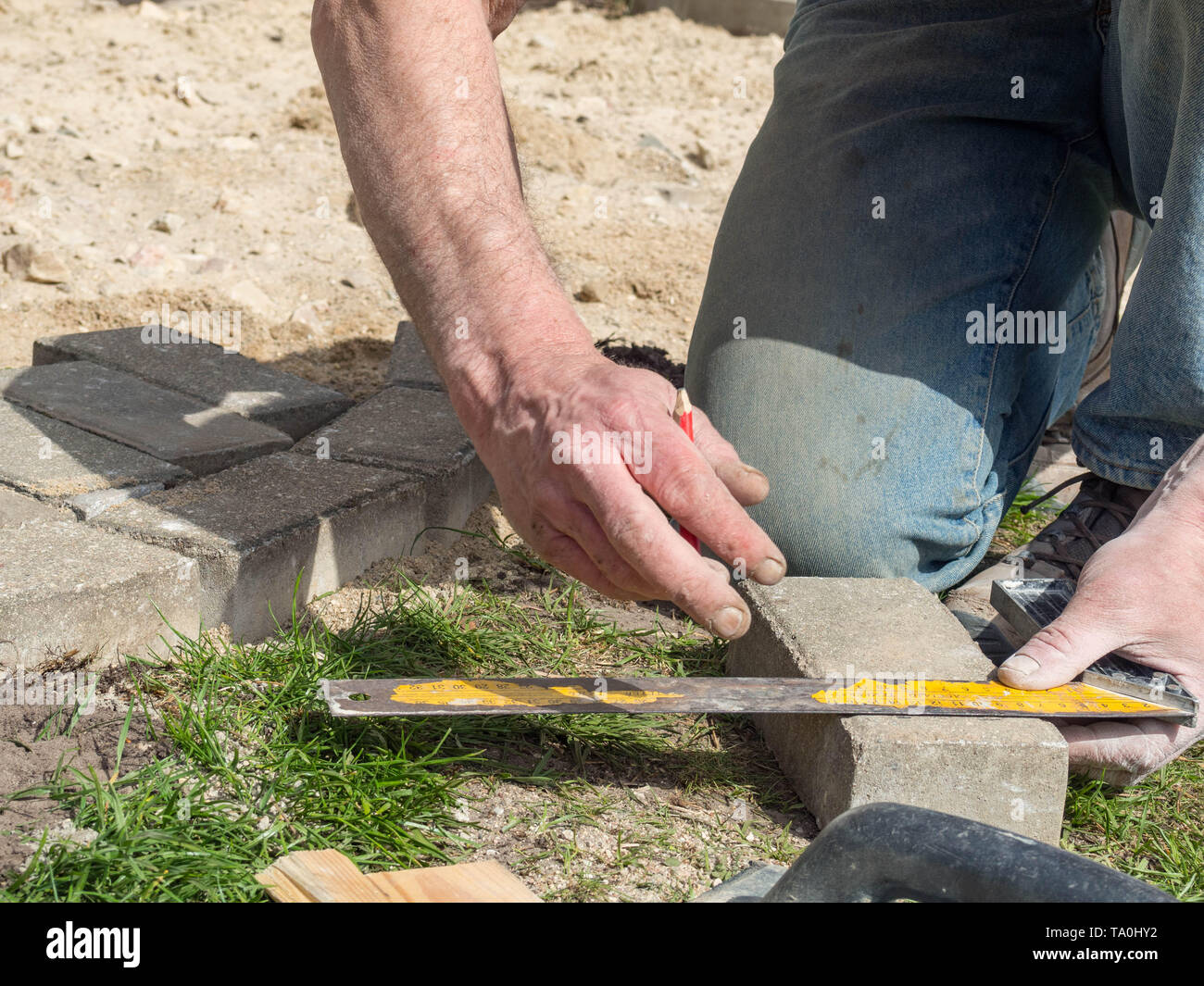 Building a terrace with measurements ruler, paving stones Stock Photo ...