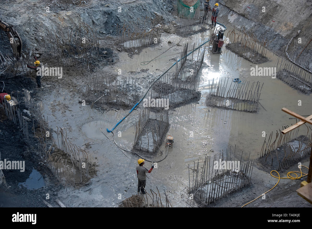High angle looking down onto a building site with construction workers ...