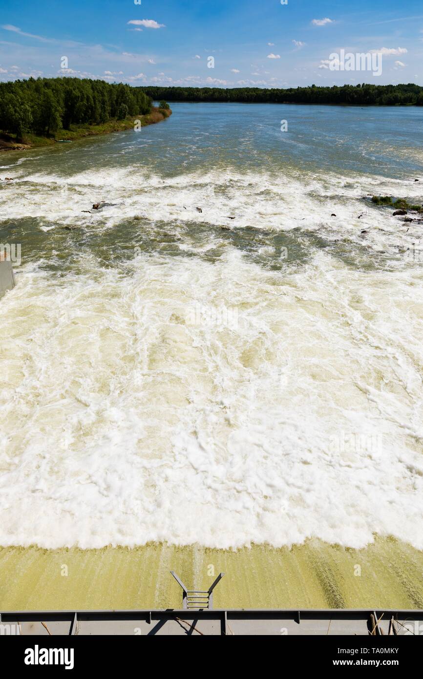 Stormy water behind floodgate at river - part of big dam - avoid floods ...