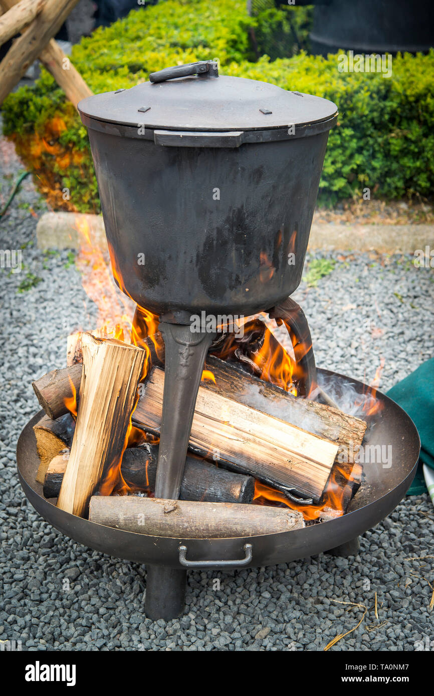 Hot cauldron with goulash soup over the fire Stock Photo - Alamy