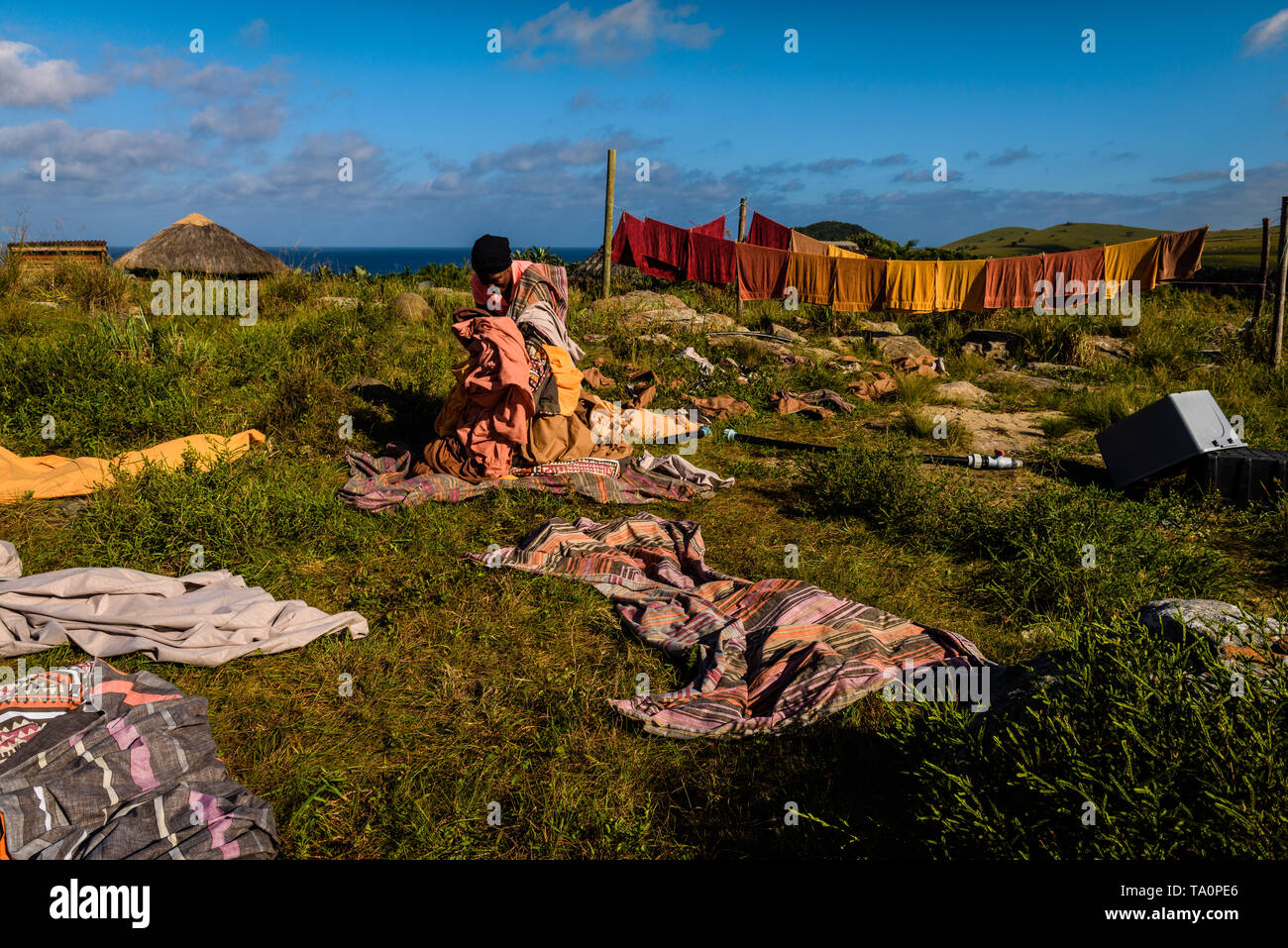 A woman sorts through laundry at the Pondoland Mtentu River Lodge in ...