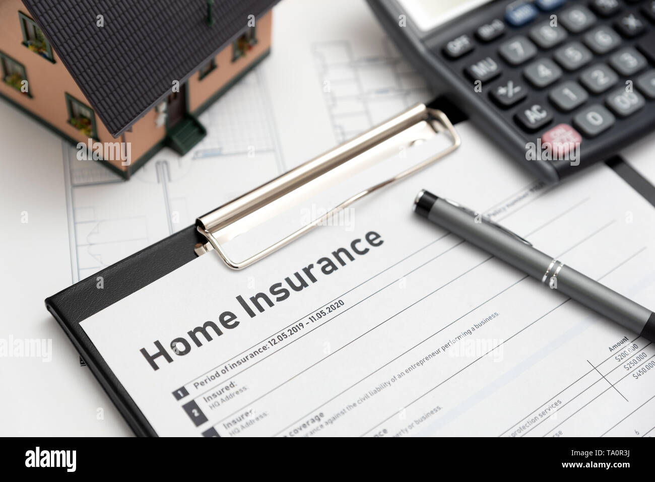 Home insurance form on the table. Assurance and home safety concept ...