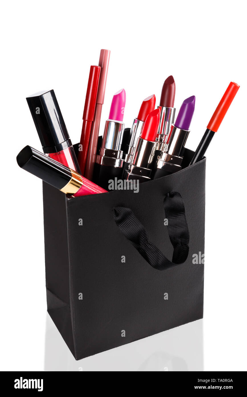 Differnt makeup objects in the shopping bag on white background Stock ...