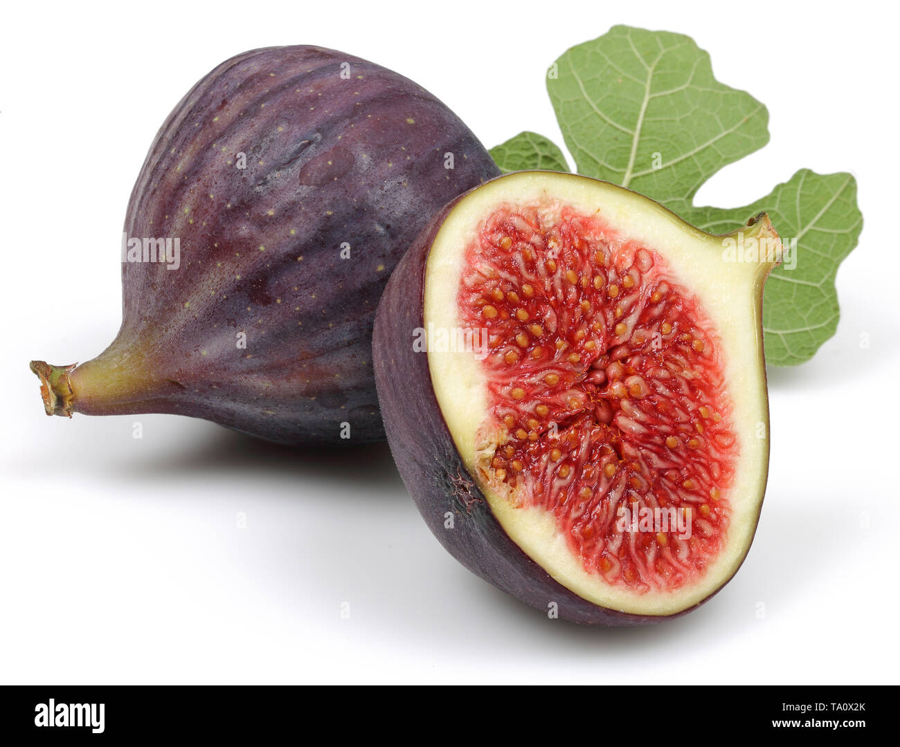 Fresh purple fig fruit and slice with leaf isolated on white background ...