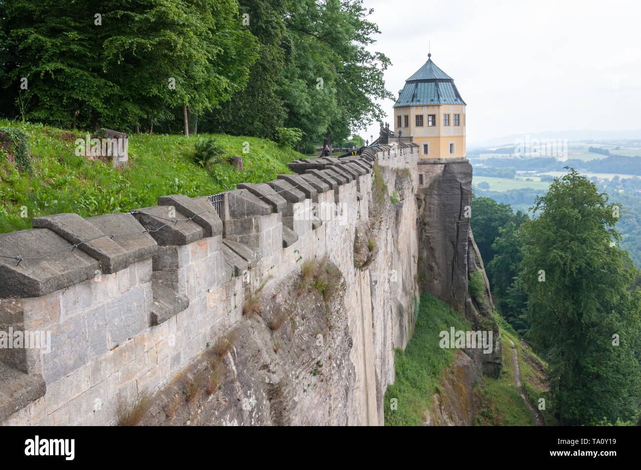 The fortress wall and the tower of an ancient medieval fortress on a ...