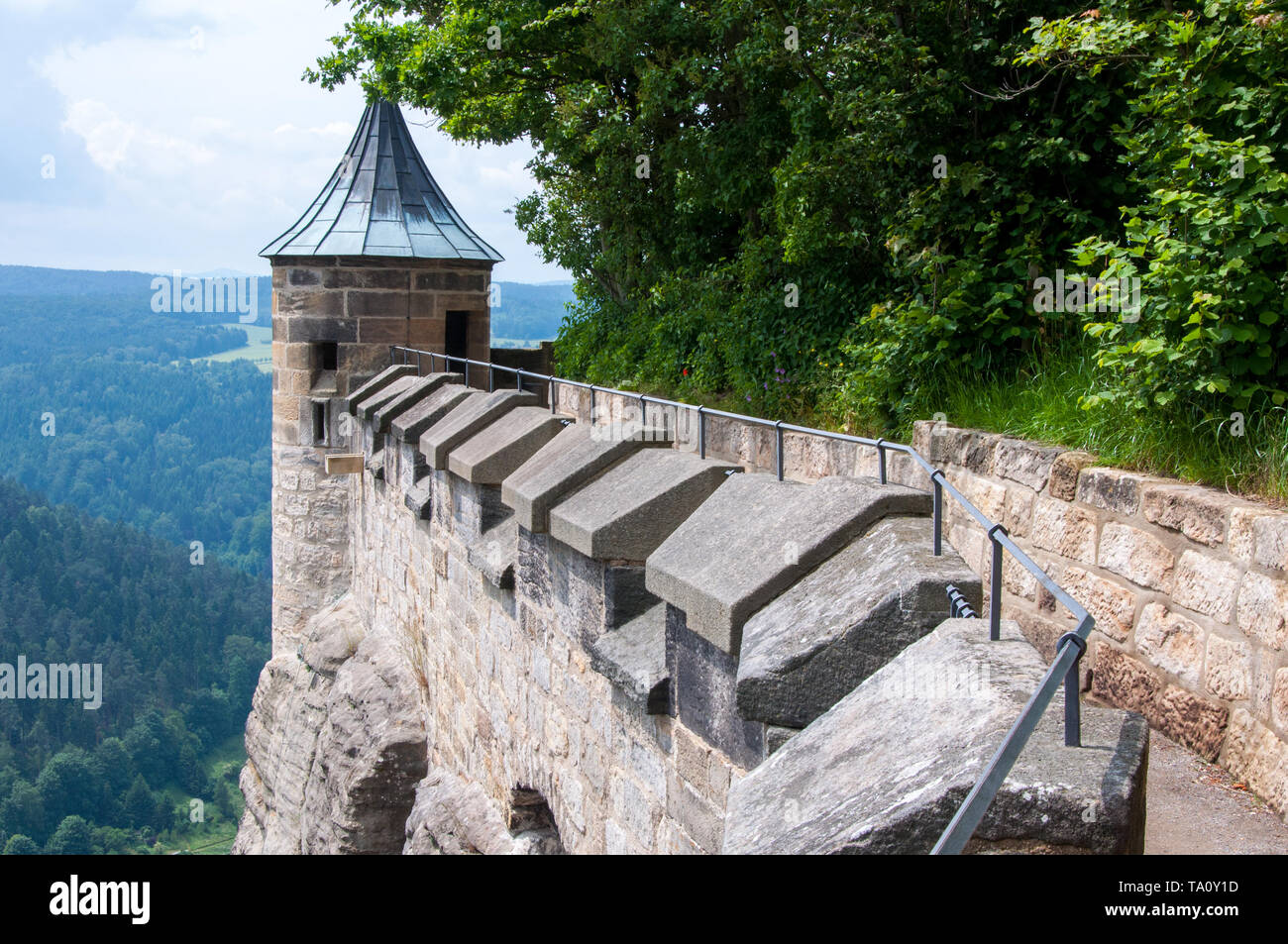 The fortress wall and the tower of an ancient medieval fortress on a ...