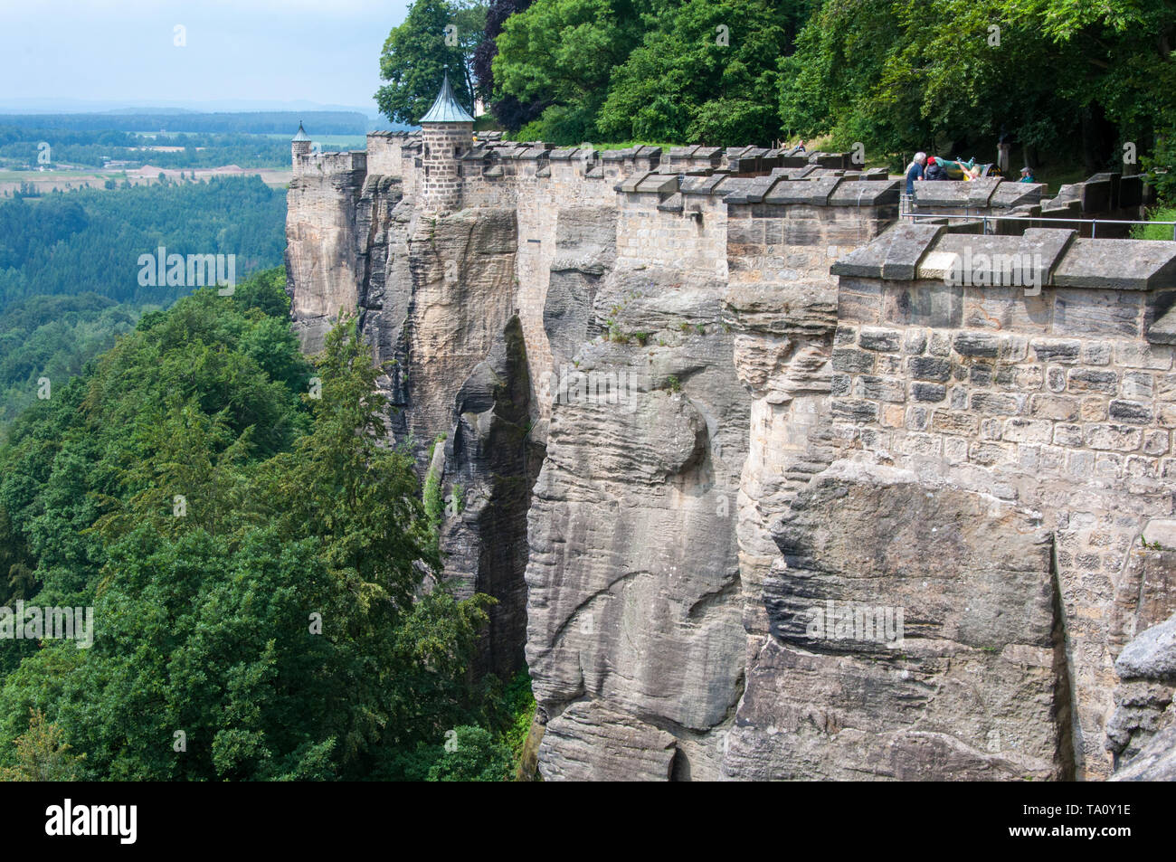 The fortress wall and the tower of an ancient medieval fortress on a ...