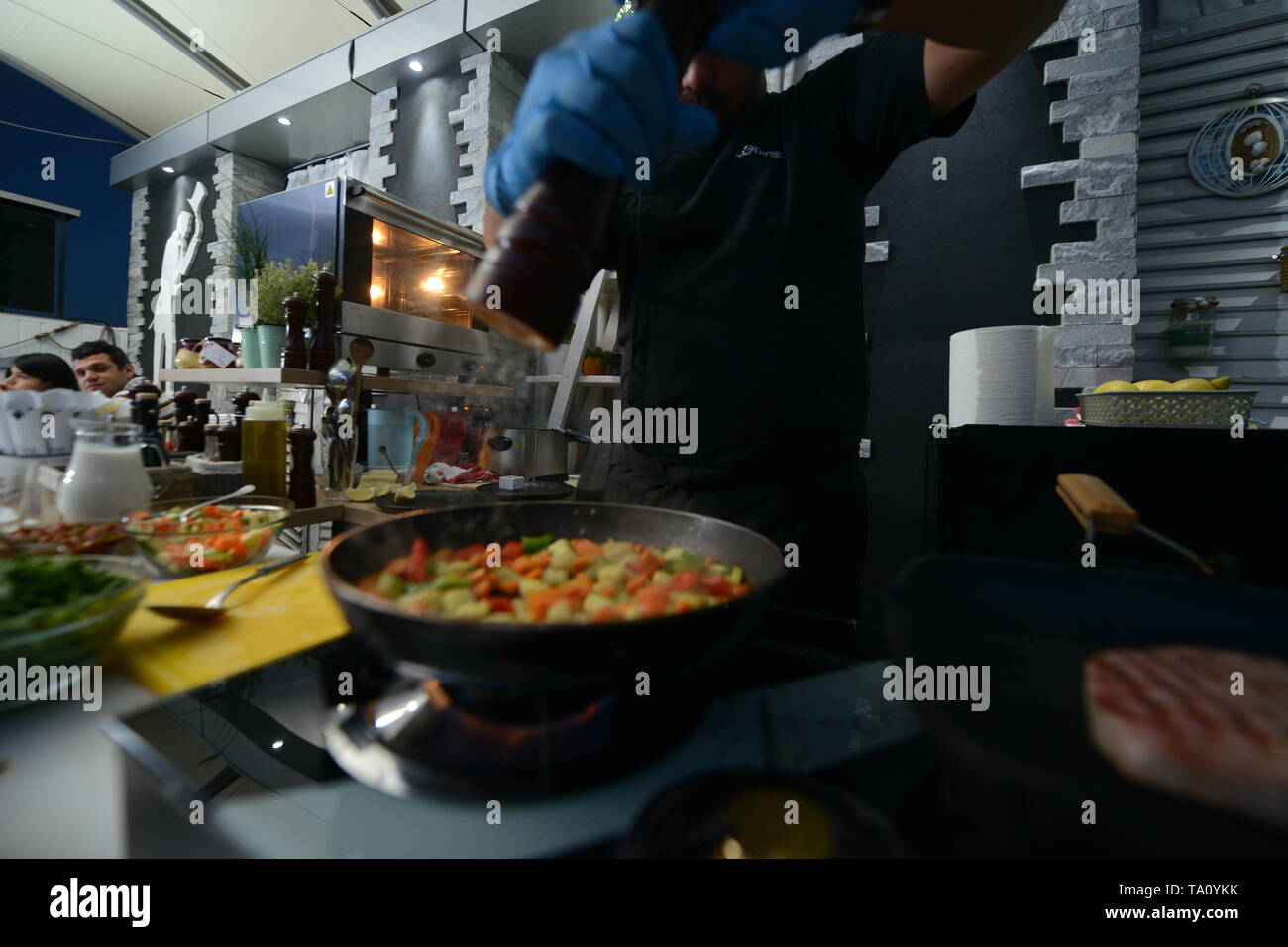 Making delicious food in restaurant. Professional cooker and vegetables ...