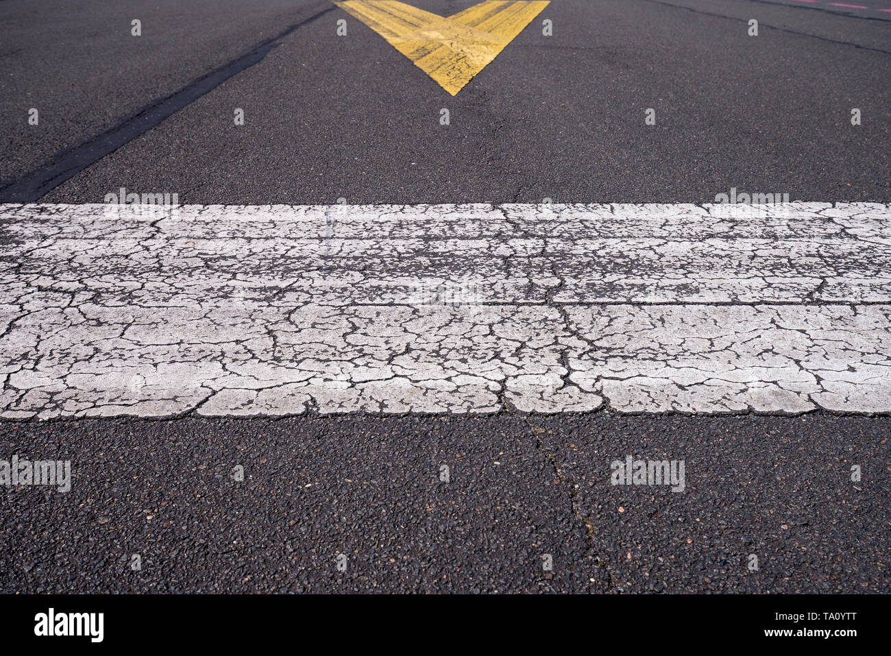 close up of road markings on an air strip Stock Photo - Alamy