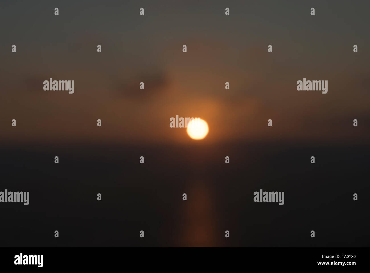 blurred sun over the ocean for backgrounds Stock Photo - Alamy