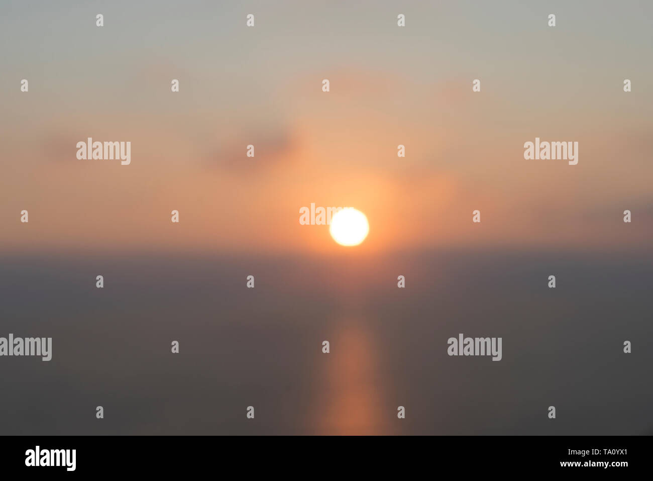 blurred sun over the ocean for backgrounds Stock Photo - Alamy