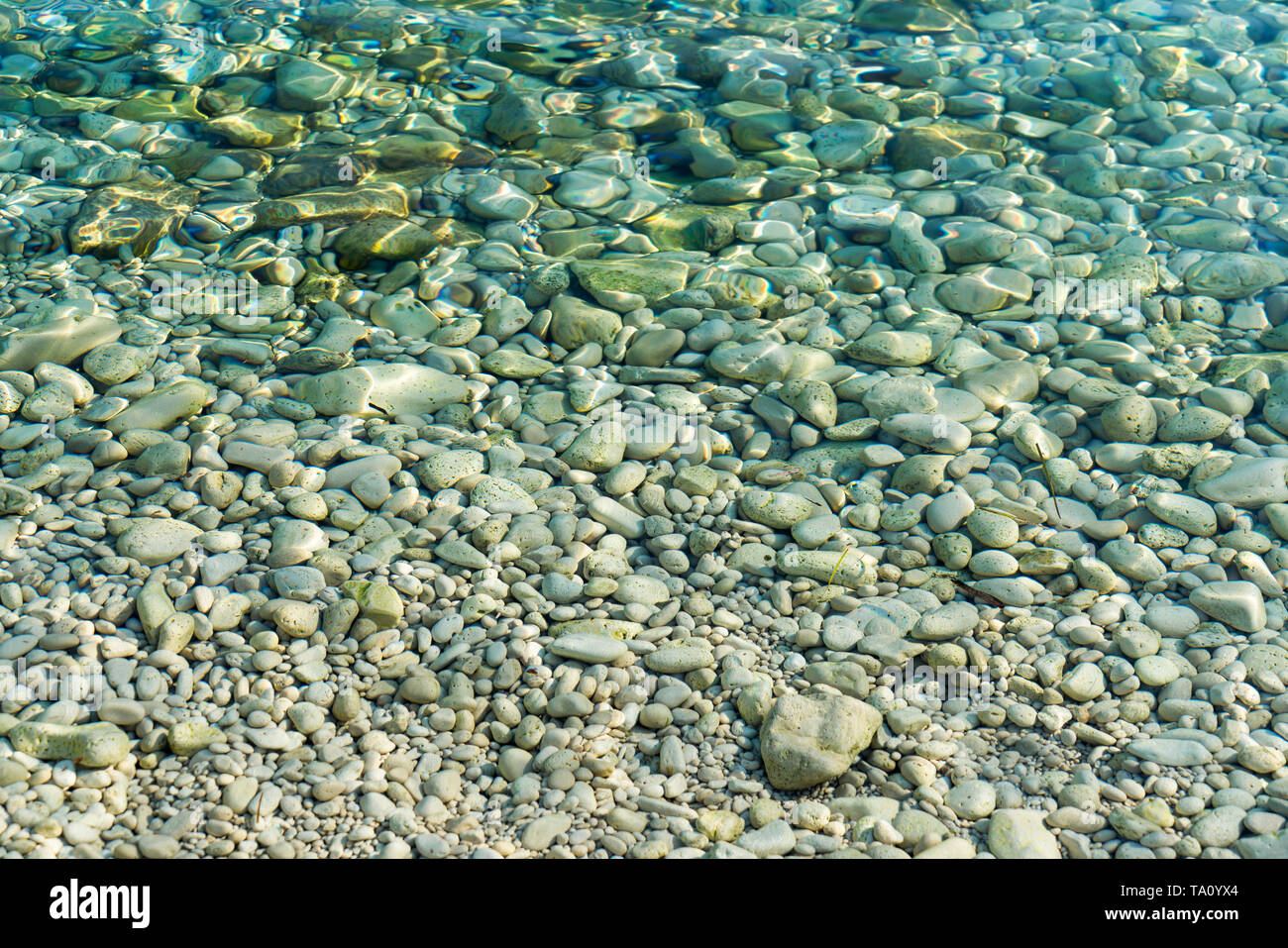 pebbles in the water for backgrounds and overlays Stock Photo - Alamy
