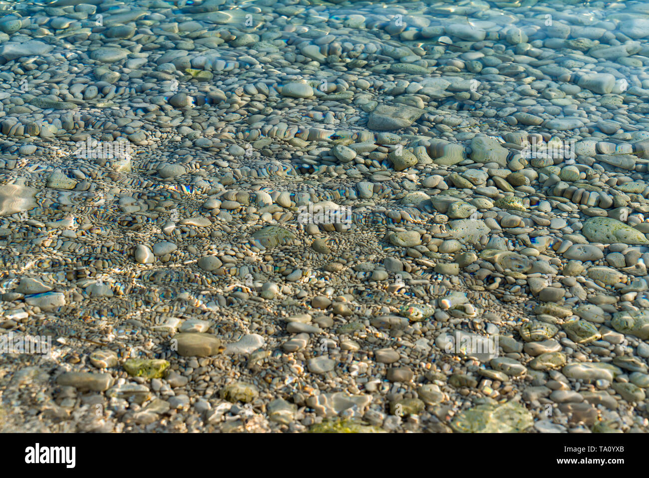 pebbles in the water for backgrounds and overlays Stock Photo - Alamy