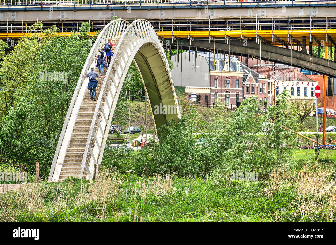 Nijmegen, The Netherlands, April 25, 2019: pedestrians climbing the ...