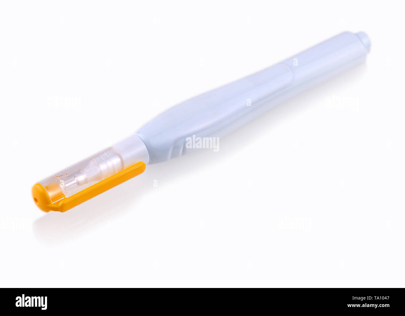Yellow pen corrector on a white background Stock Photo - Alamy