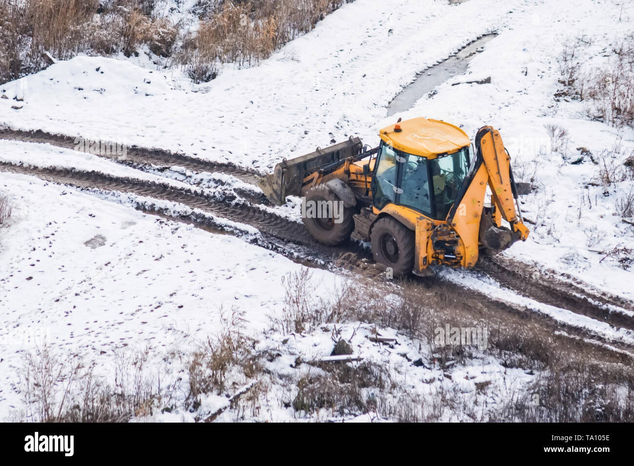 Construction site with excavator working with soil Stock Photo - Alamy