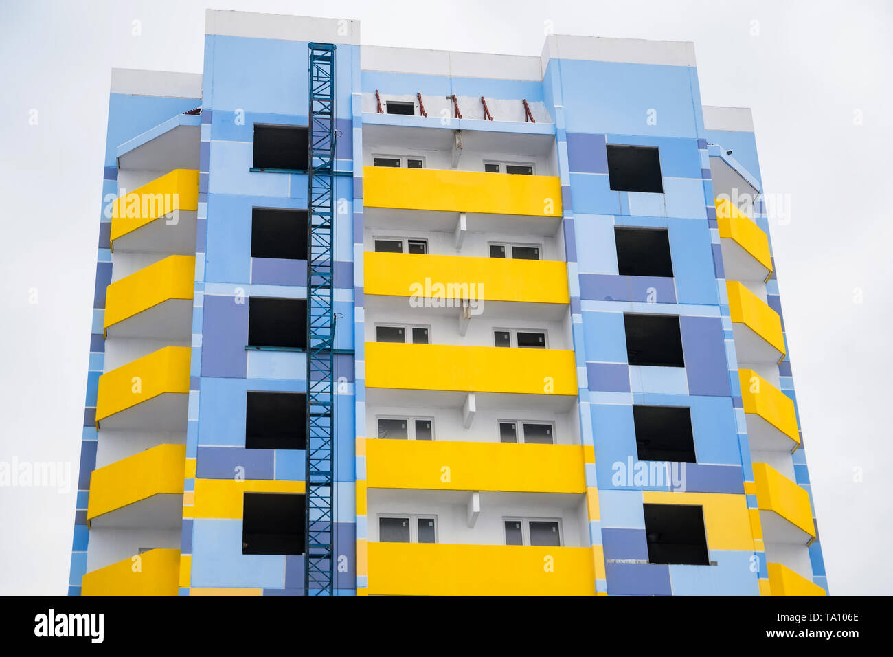 View of newly constructed high-rise building in winter Stock Photo - Alamy