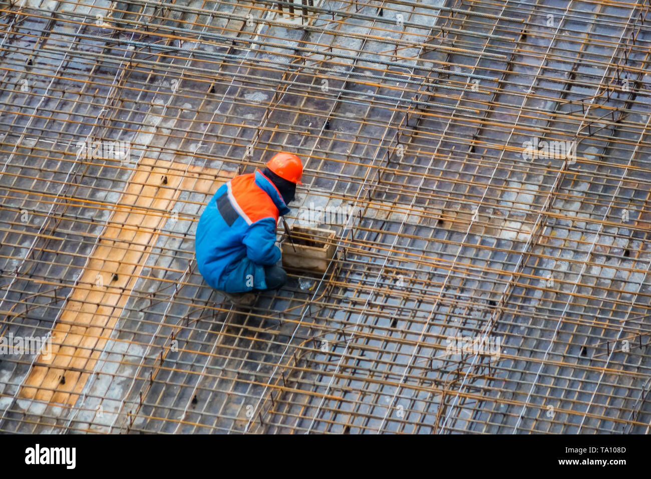 Workers and carcass made of fitness at construction site Stock Photo ...