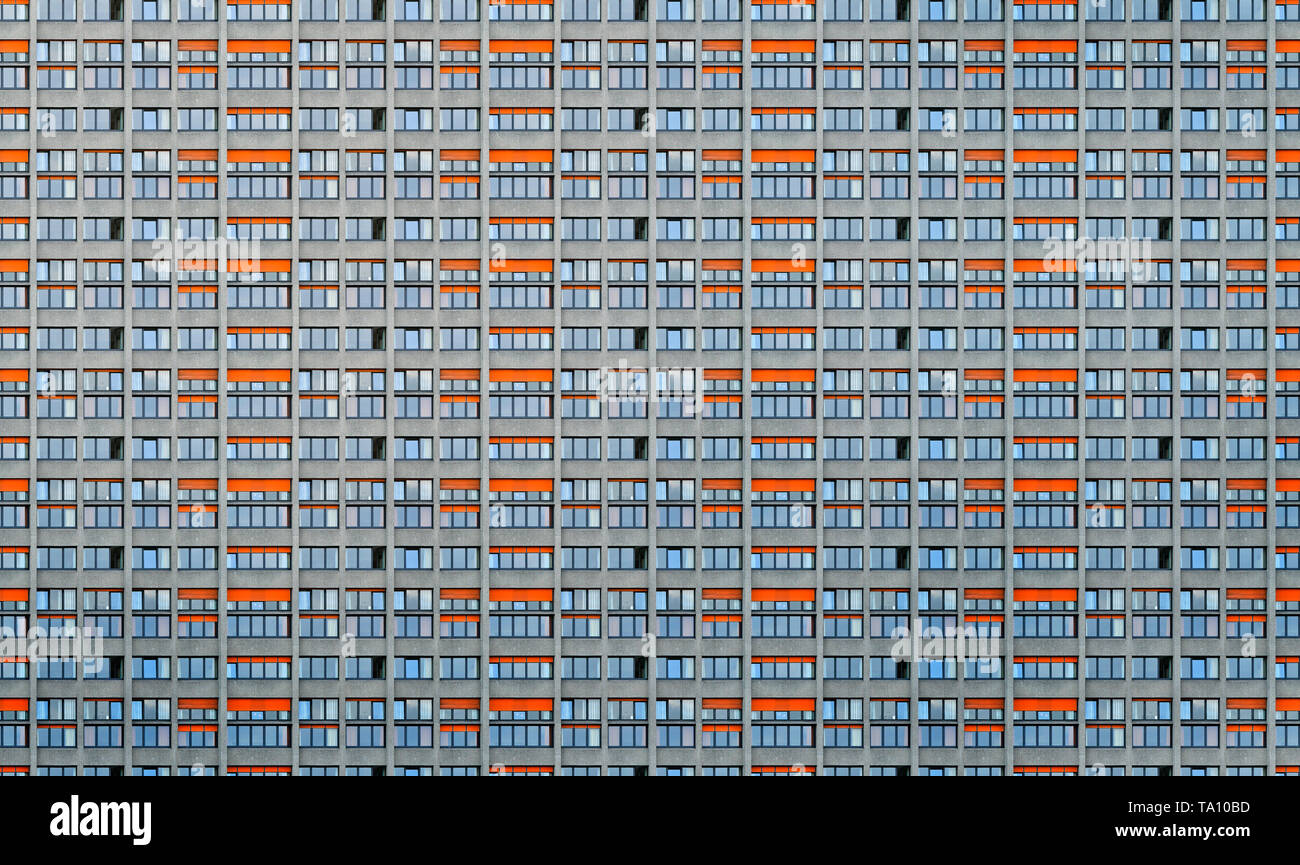 architectural pattern, window facade with orange shutters of a ...