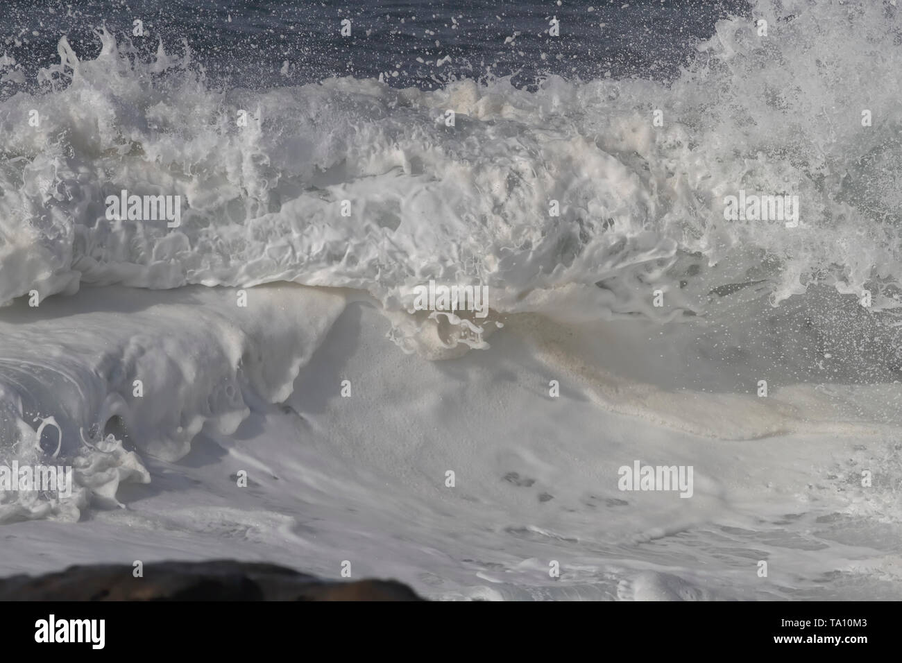Breaking sea milky wave of foam Stock Photo - Alamy