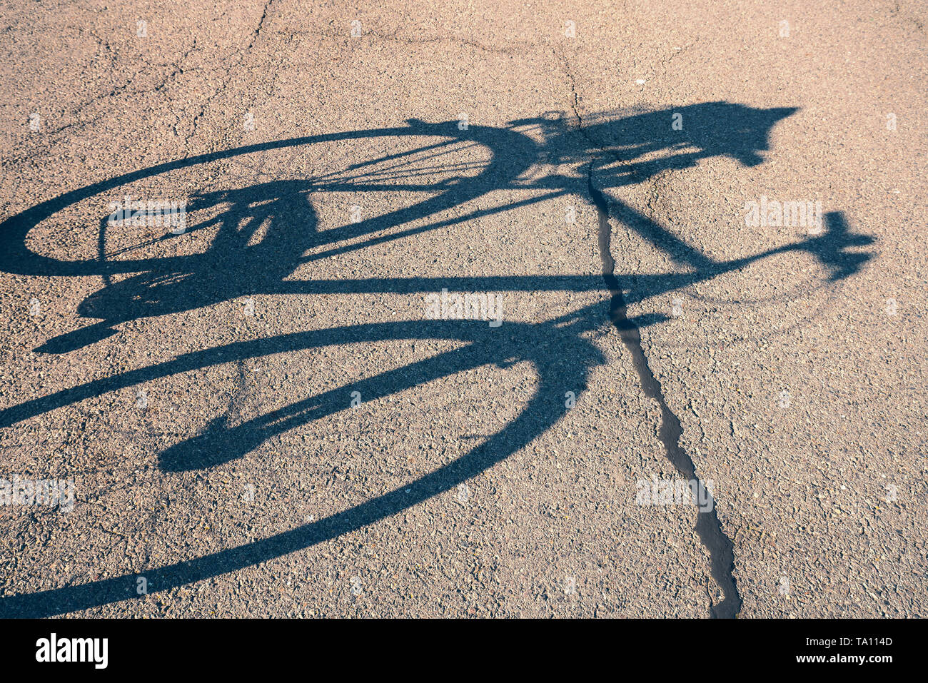 Old bike wheel shadow on road hi-res stock photography and images - Alamy