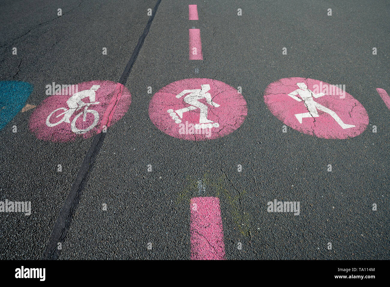 red road marking for bicycles, skater and jogger Stock Photo - Alamy