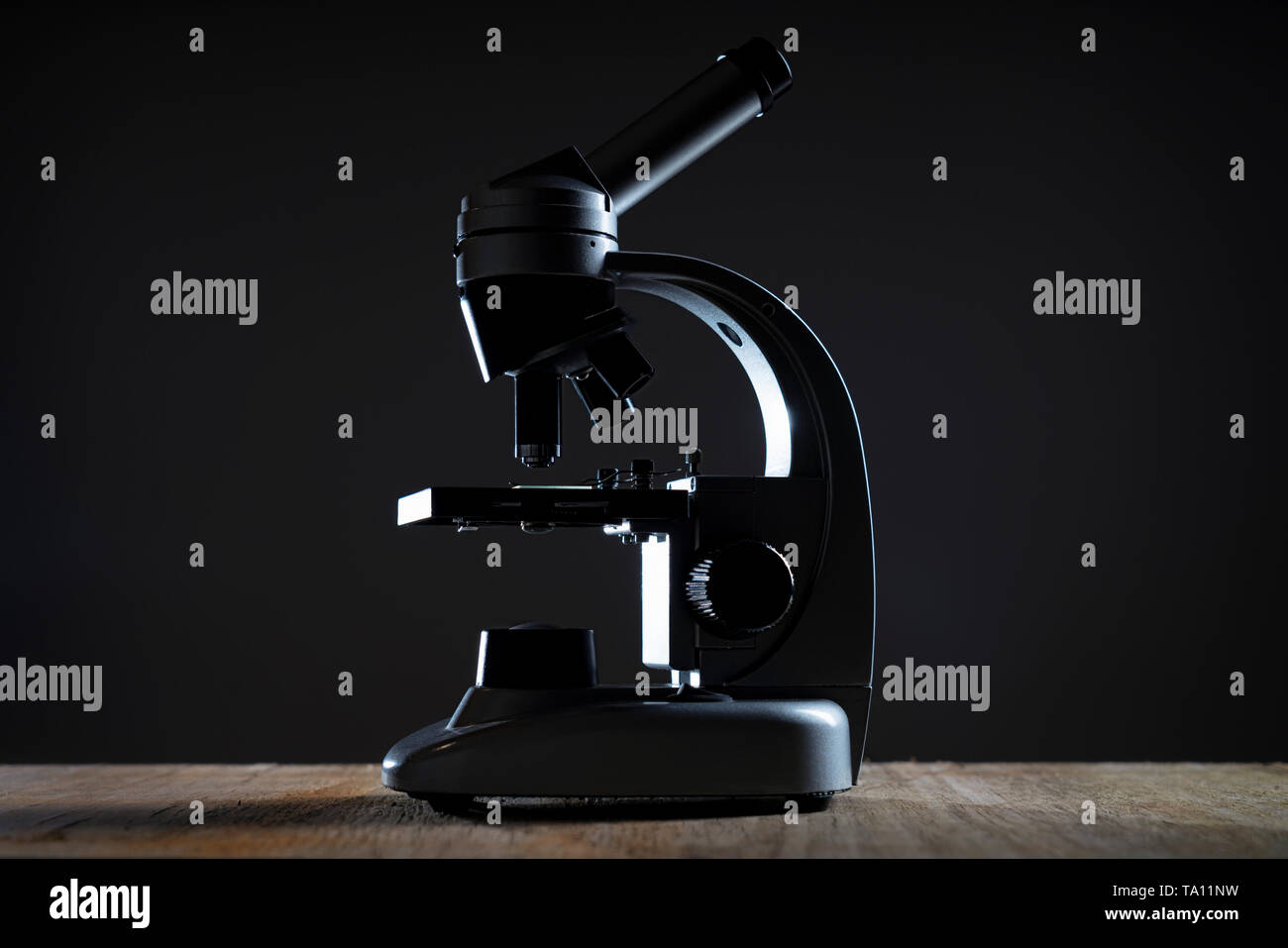 close up of a microscope in a dark room Stock Photo - Alamy
