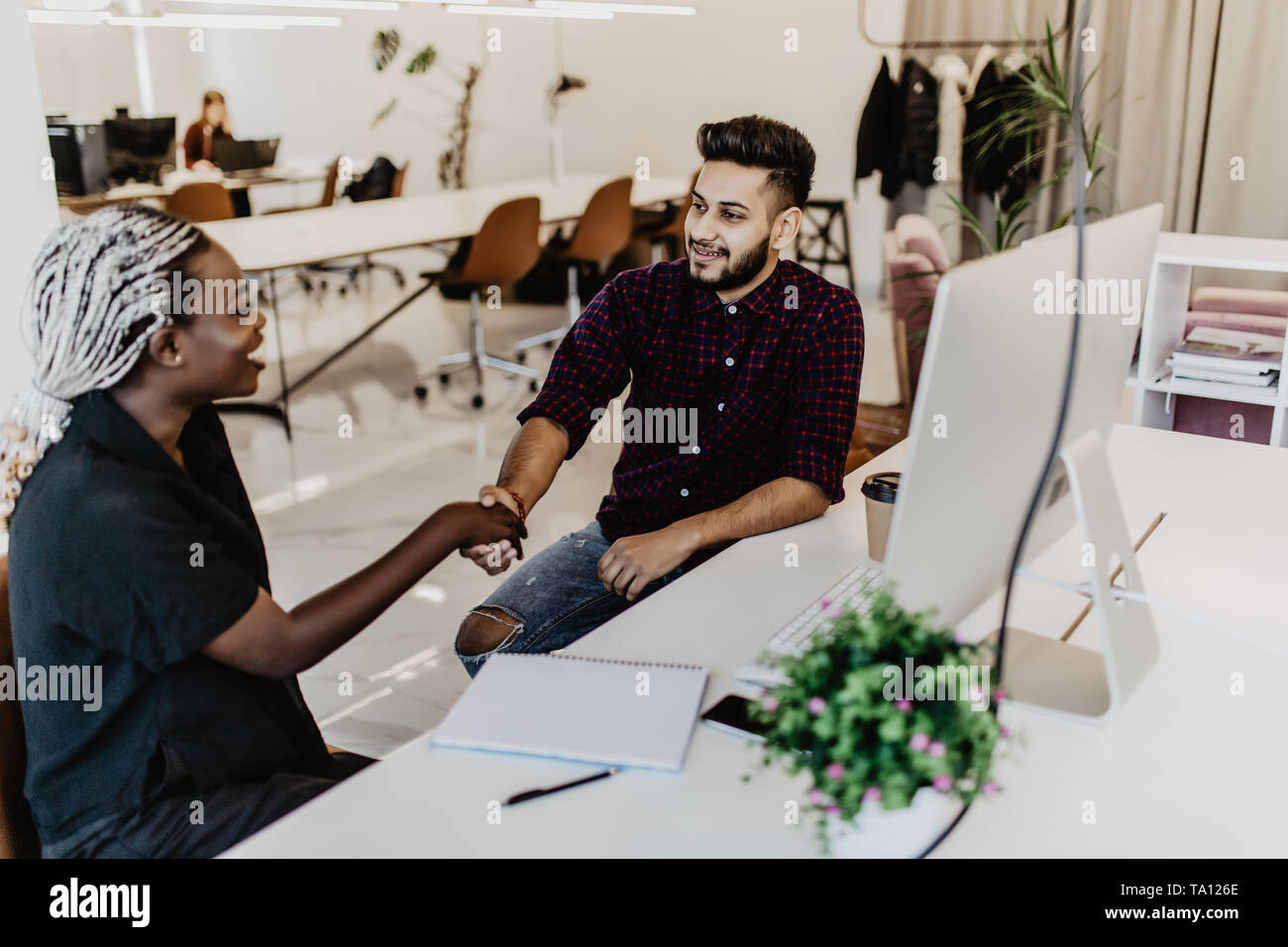 Friendly smiling indian businessman and african businesswoman ...