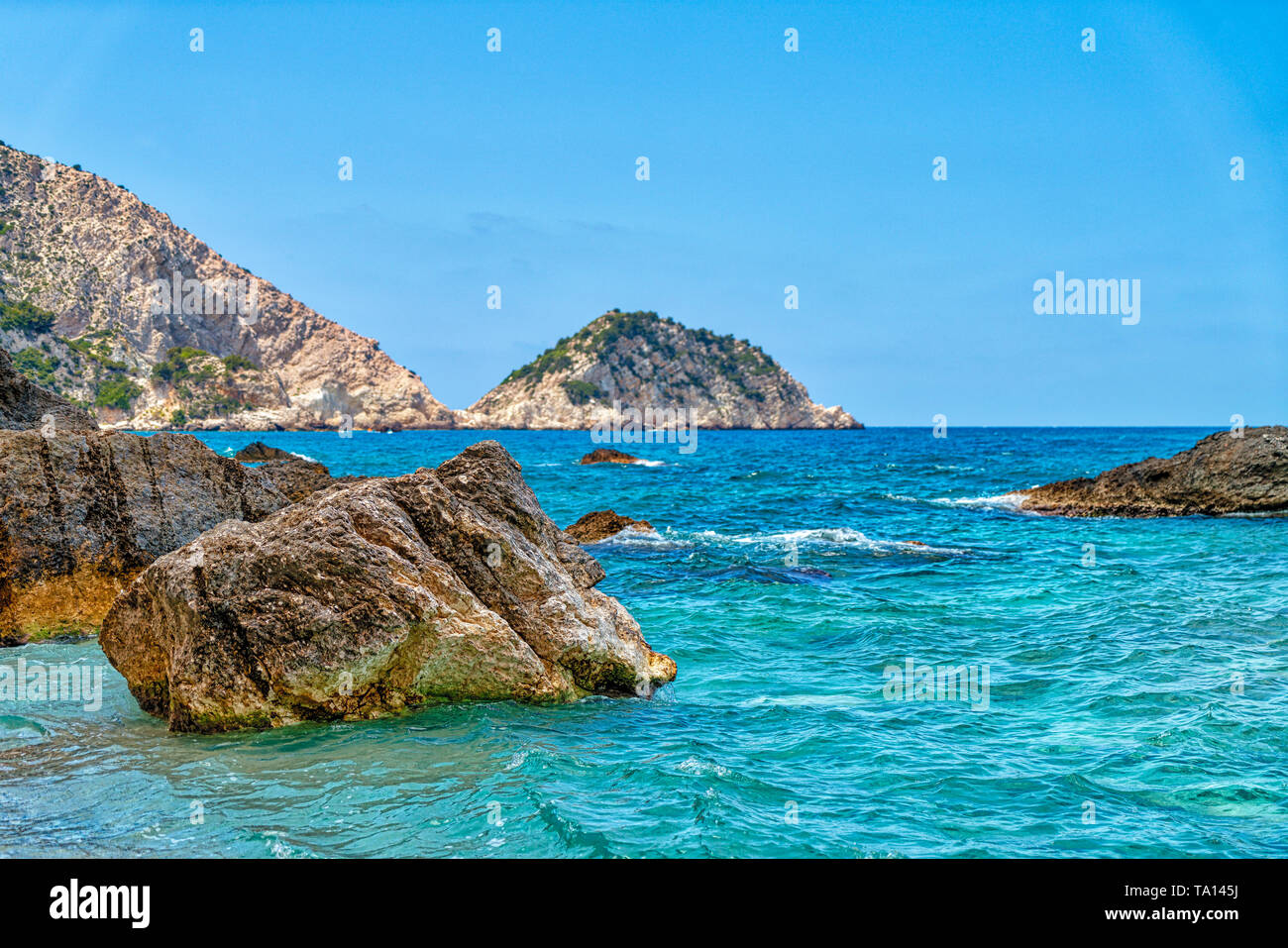mediterranean shore with cliffs and rocks Stock Photo - Alamy