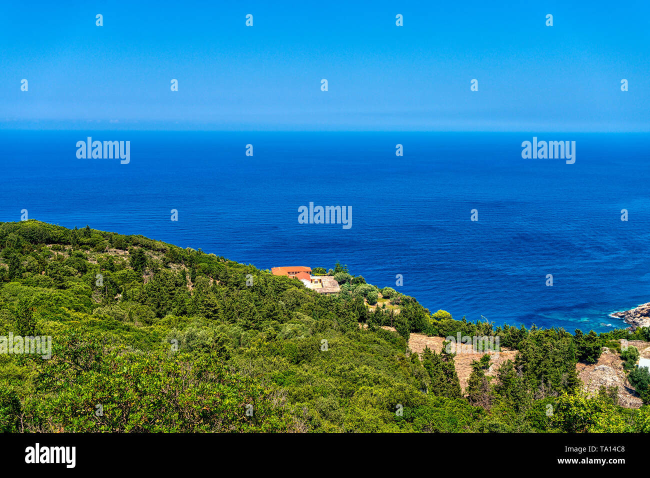 green mediterranean hill next to the blue sea Stock Photo - Alamy